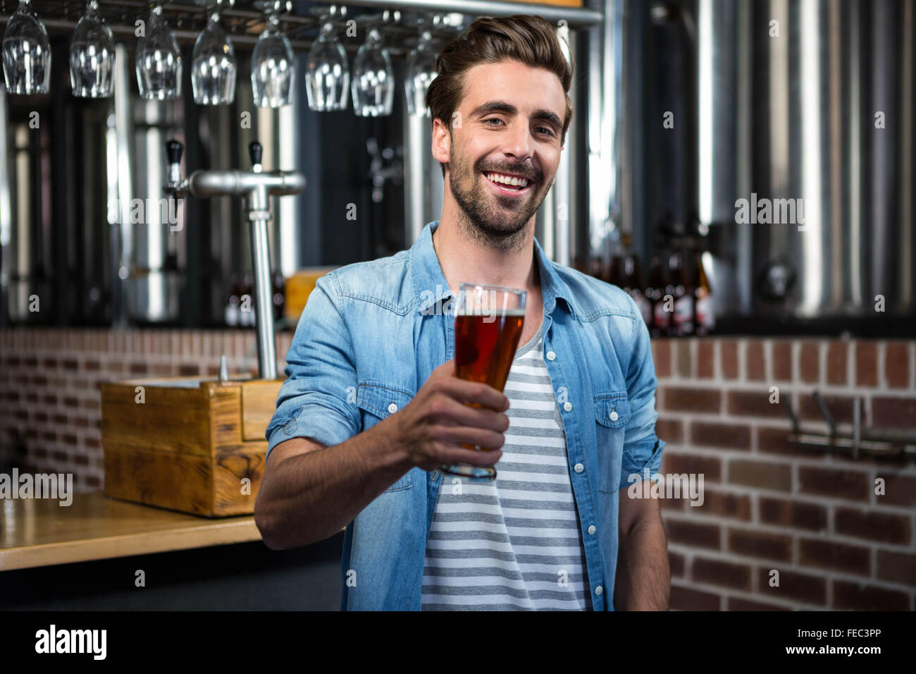 Man holding pint hi-res stock photography and images - Alamy
