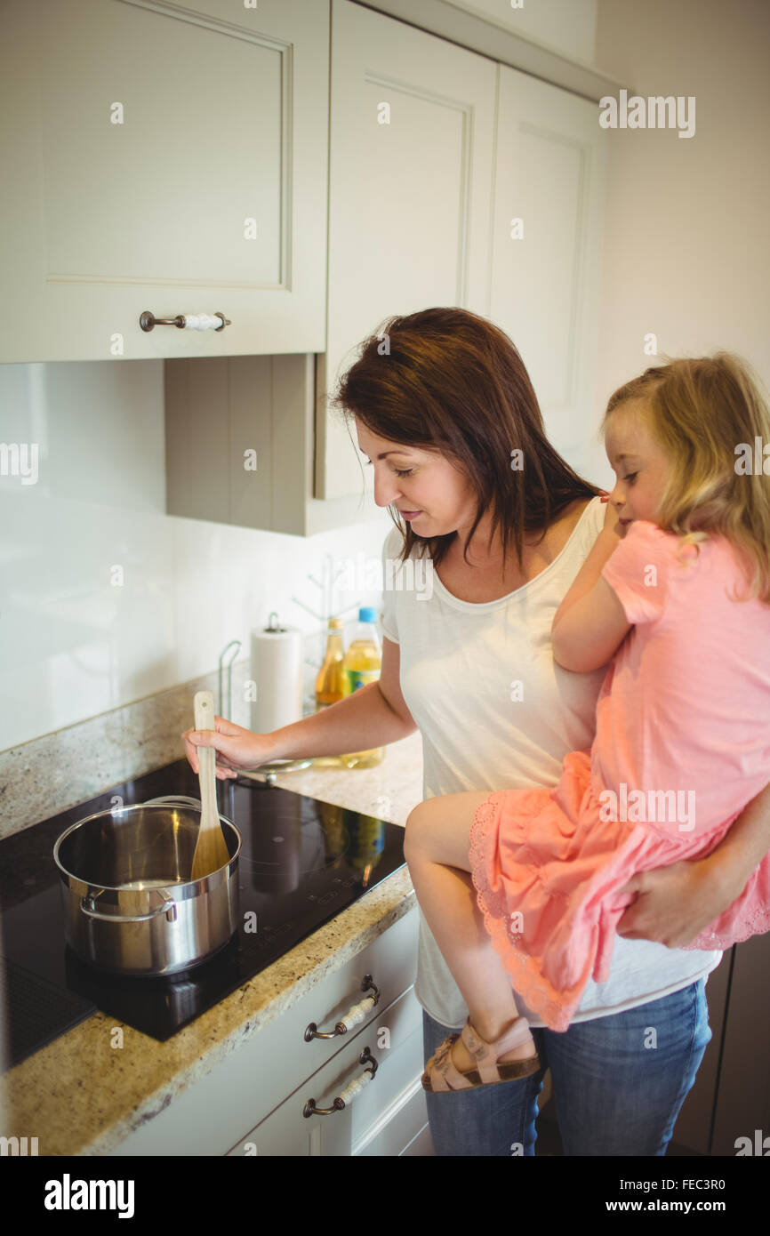 Mother and daughter cooking Stock Photo - Alamy