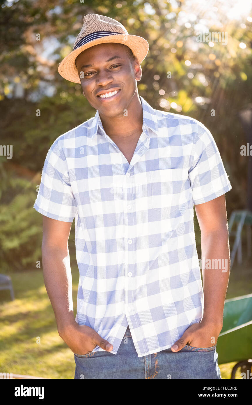 Handsome man wearing straw hat Stock Photo - Alamy