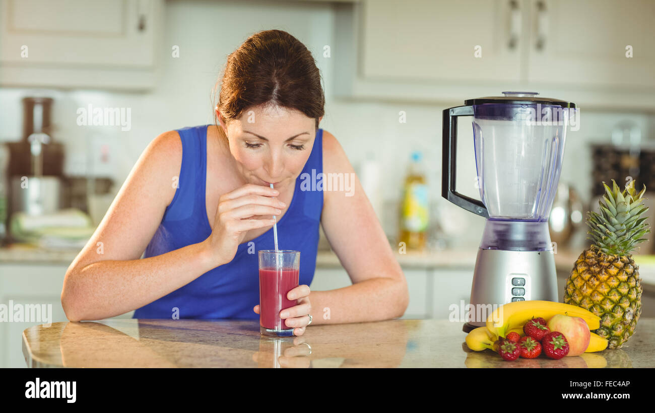 Woman drinking smoothie Stock Photo - Alamy
