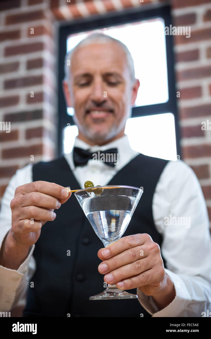 Handsome smiling male waiter giving hi-res stock photography and images ...
