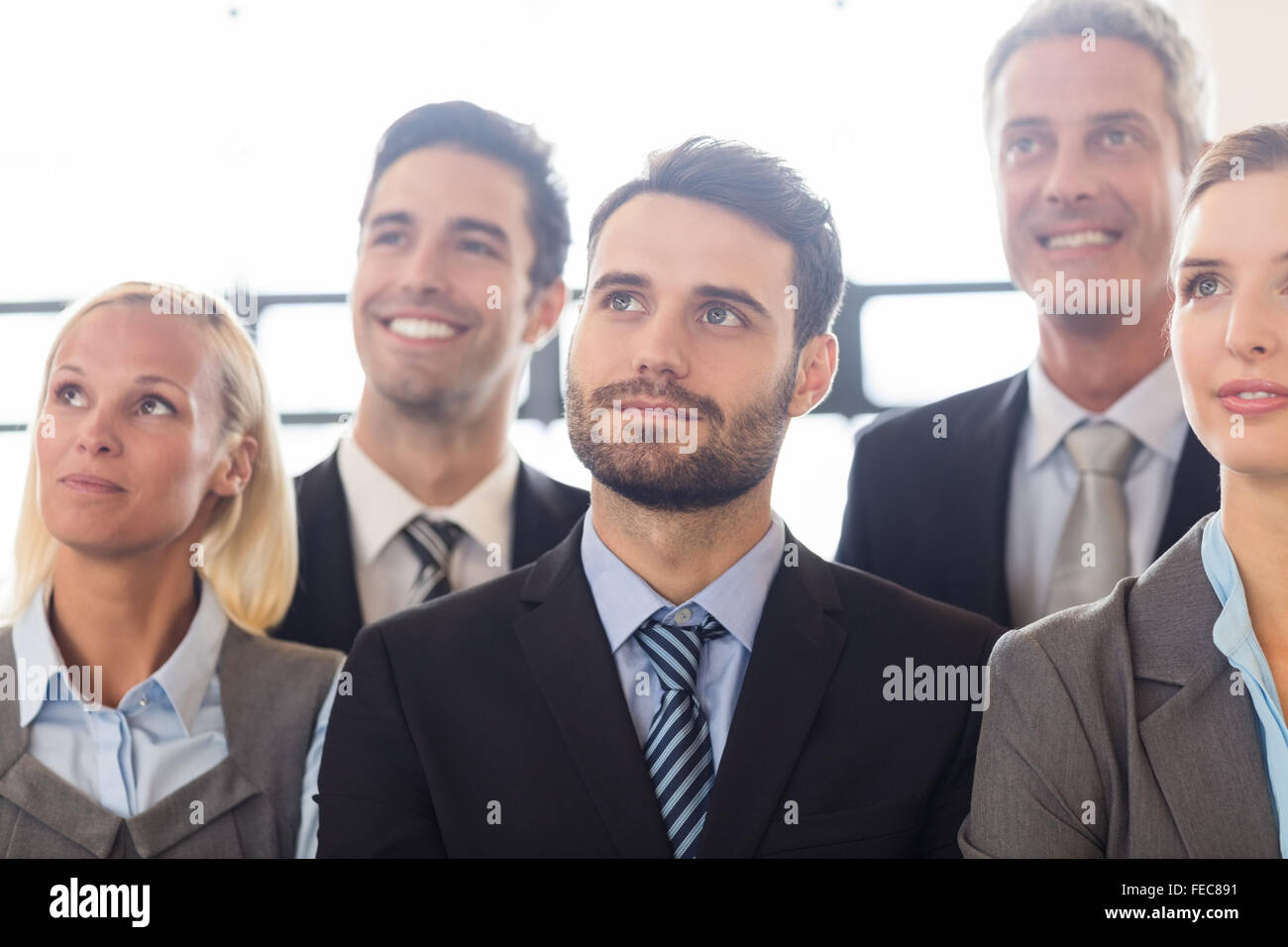 Business team looking up together Stock Photo - Alamy