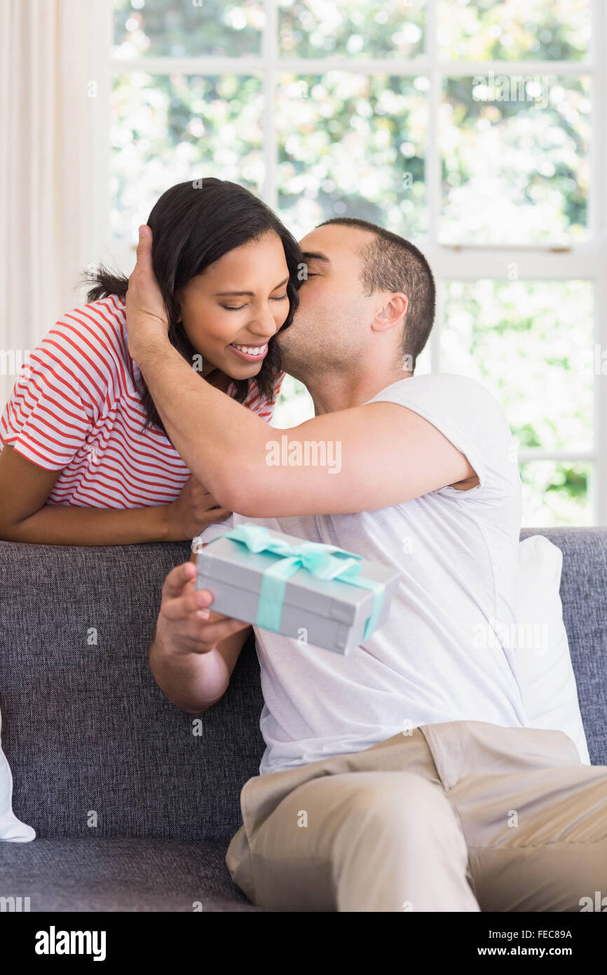 Happy couple receiving a gift Stock Photo - Alamy