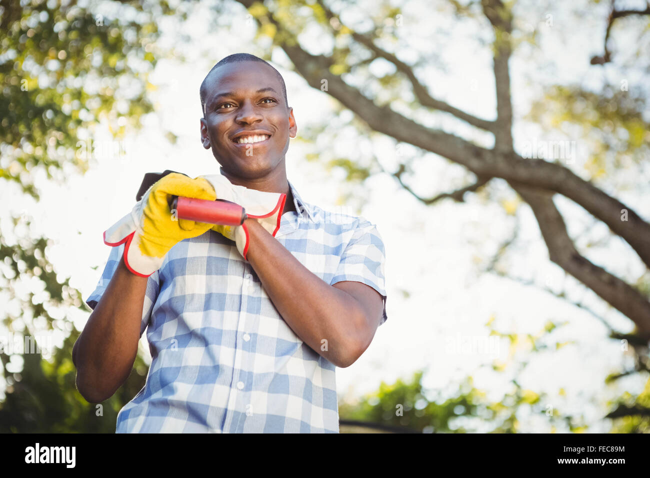 Man holding shovel hi-res stock photography and images - Alamy