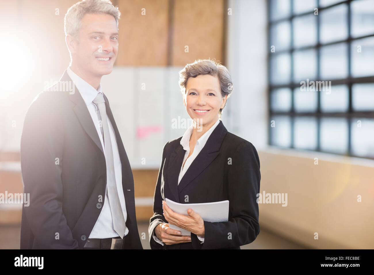Business team smiling at camera together Stock Photo - Alamy