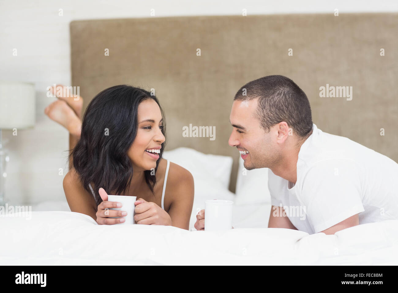Romantic couple drinking coffee lying hi-res stock photography and ...