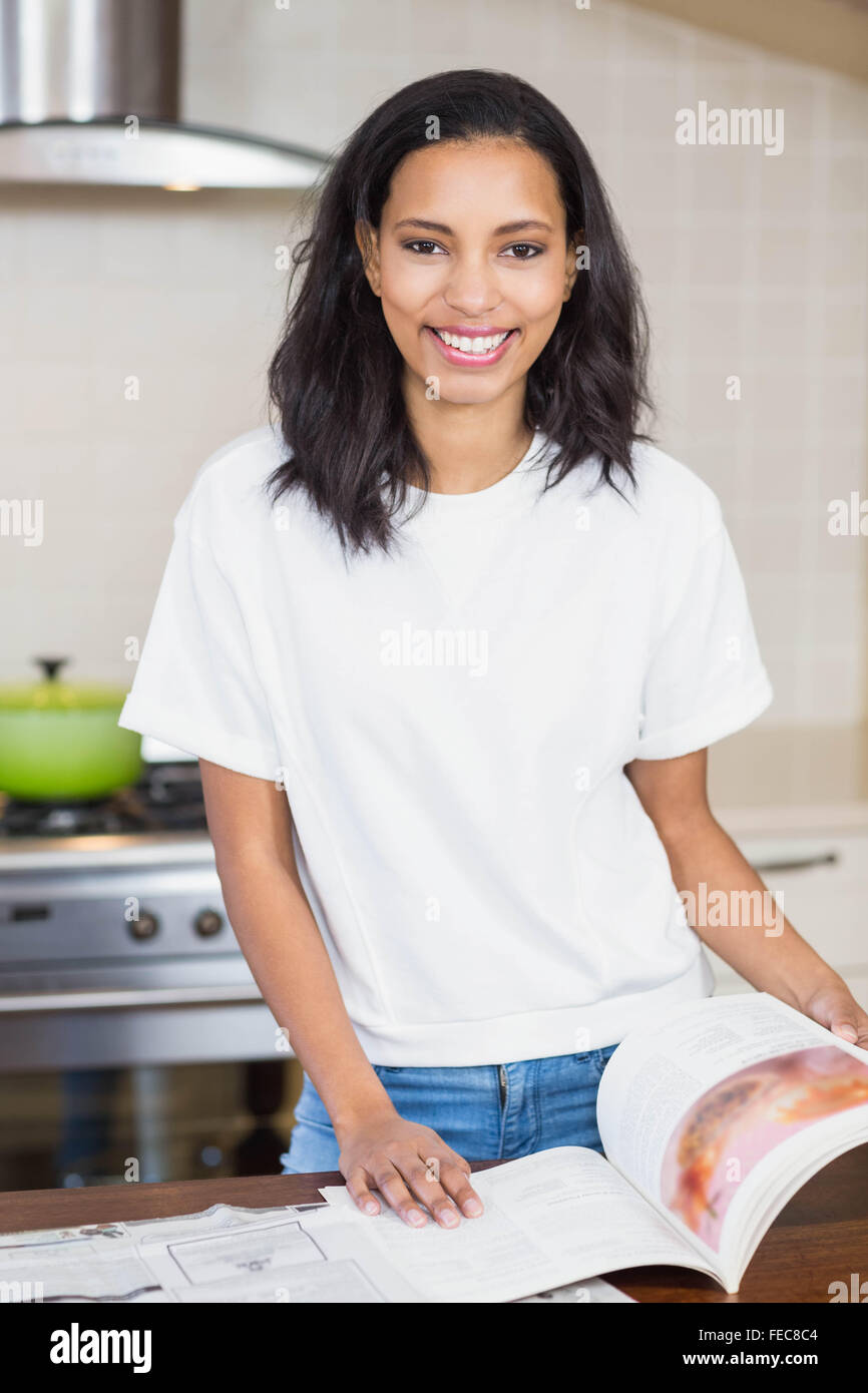 Smiling woman reading a magazine Stock Photo - Alamy