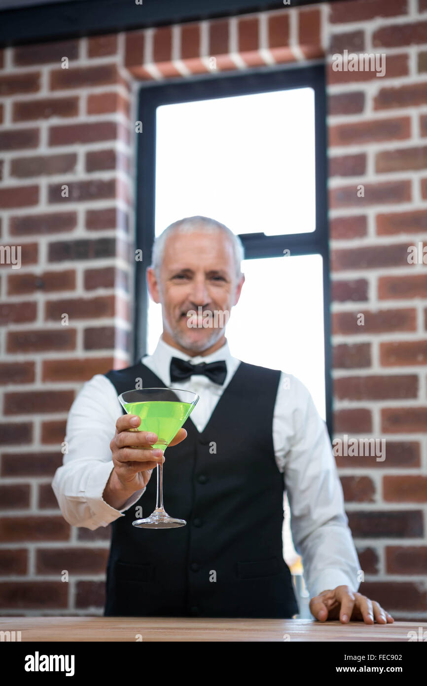 Handsome smiling male waiter giving hi-res stock photography and images ...