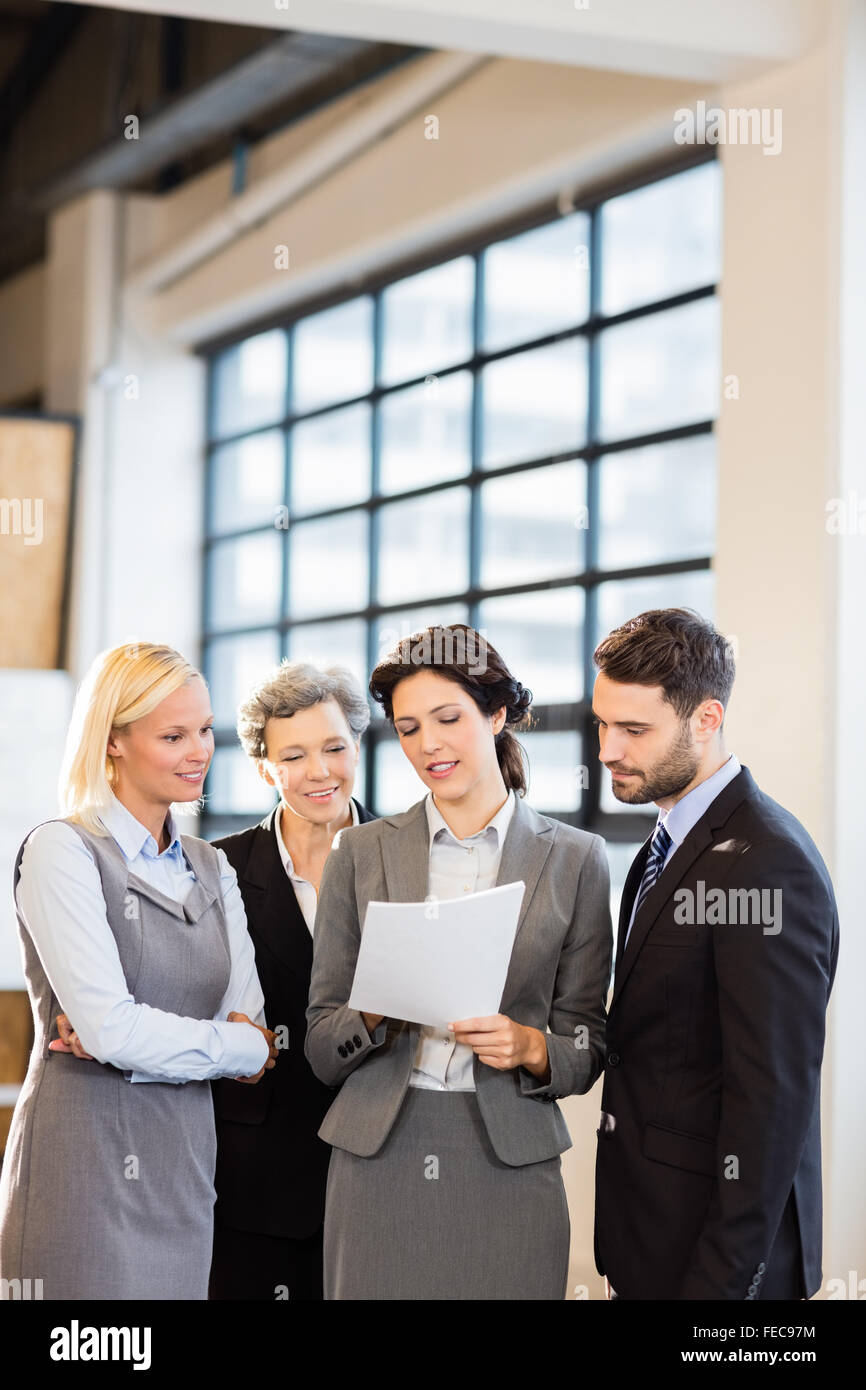 Business team standing and speaking Stock Photo - Alamy