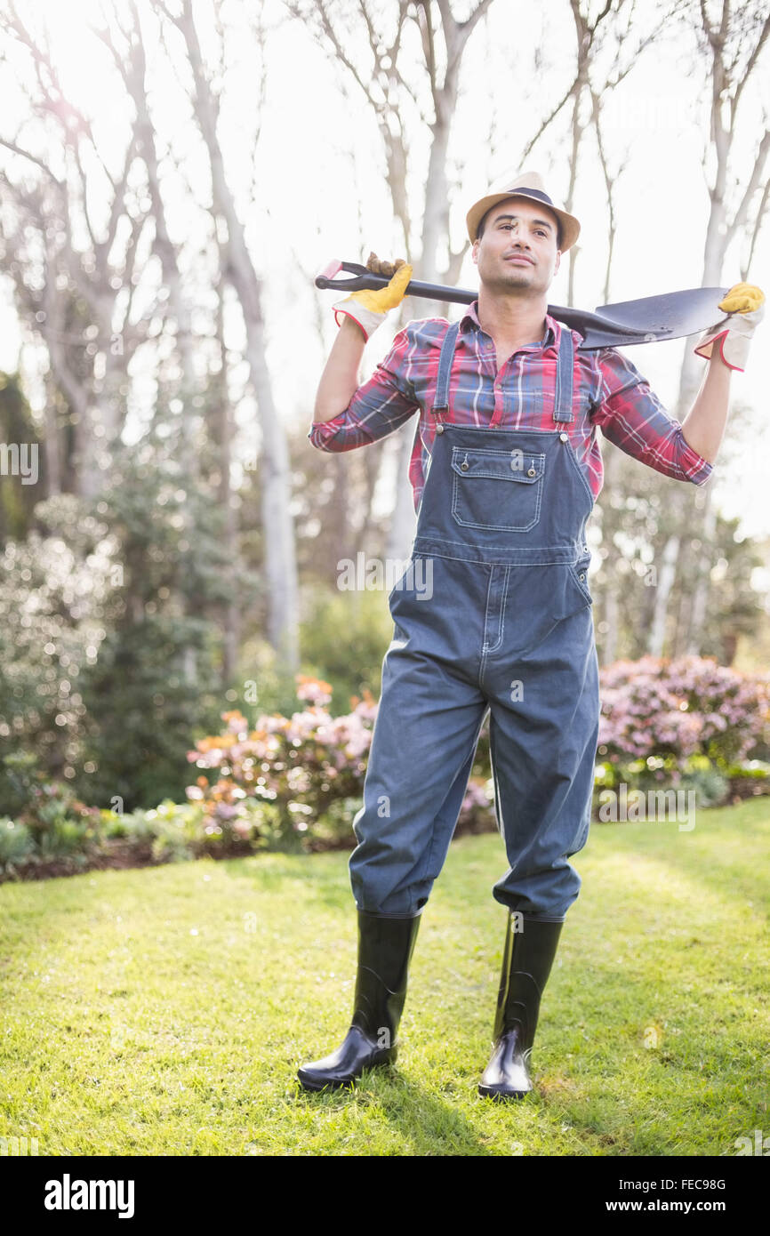 Gardener man posing with his shovel Stock Photo - Alamy