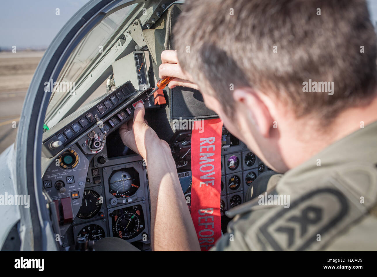 HANDOUT - An aircraft avionics sergeant rebuilding the cockpit lights ...
