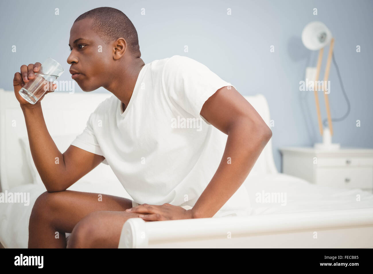 Handsome man drinking water Stock Photo - Alamy