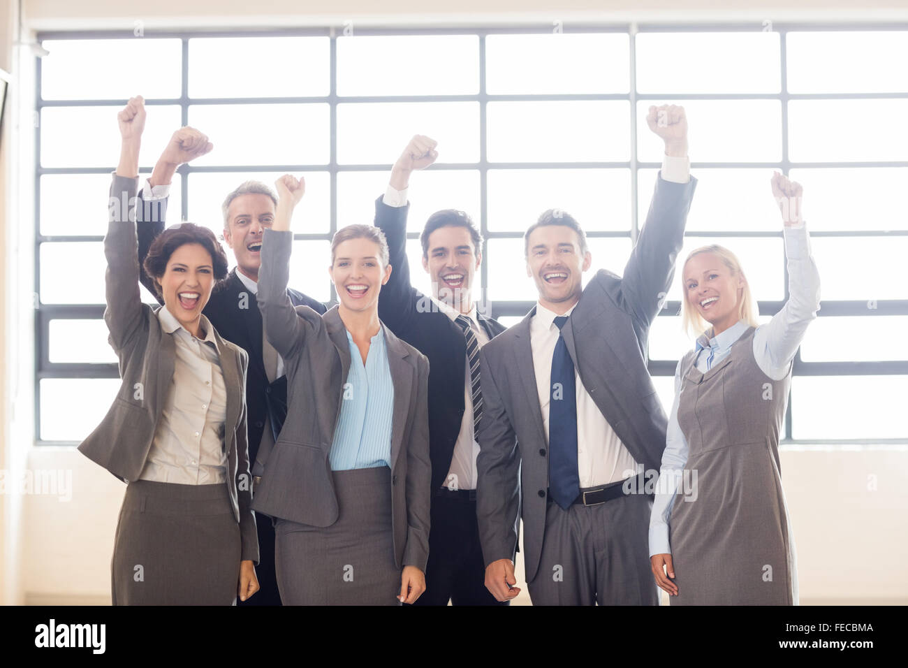 Business team cheering at the camera Stock Photo - Alamy