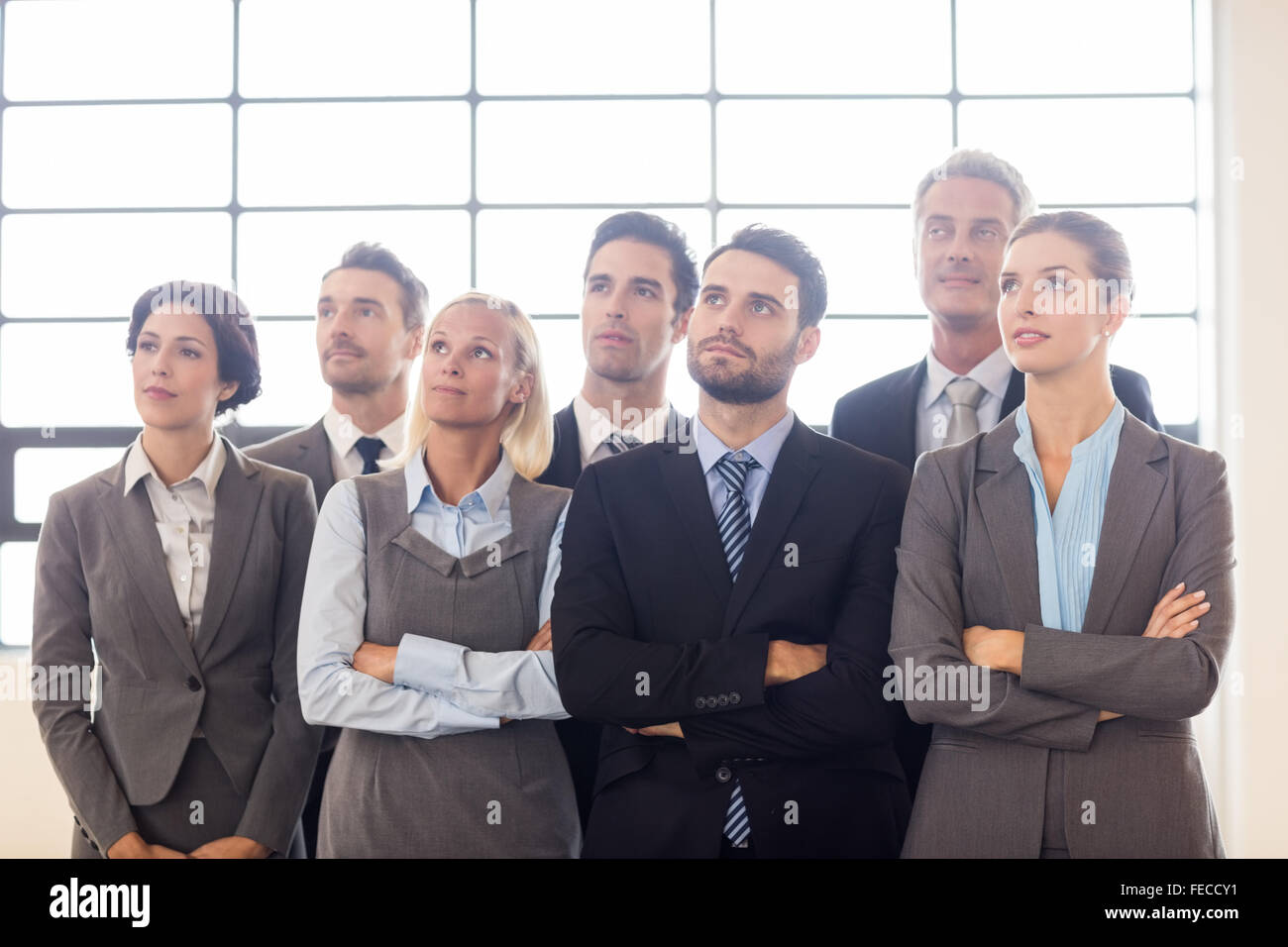 Business team looking up together Stock Photo - Alamy