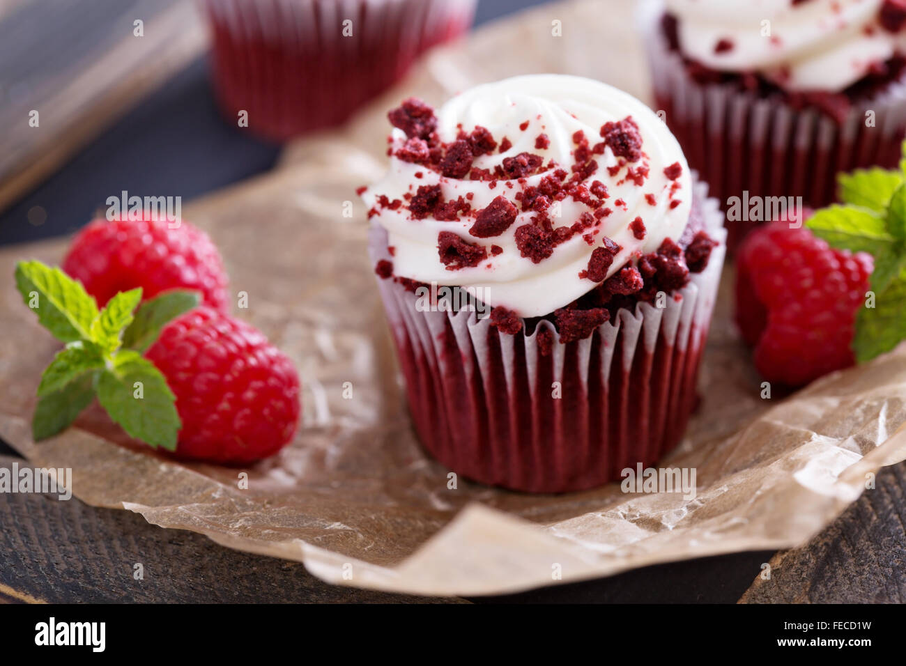Red velvet cupcakes on parchment rustic background Stock Photo - Alamy