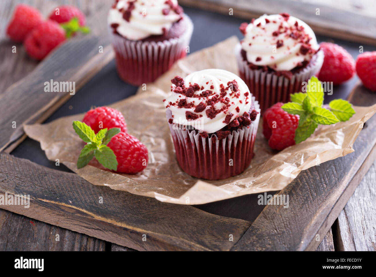 Red velvet cupcakes on parchment rustic background Stock Photo - Alamy