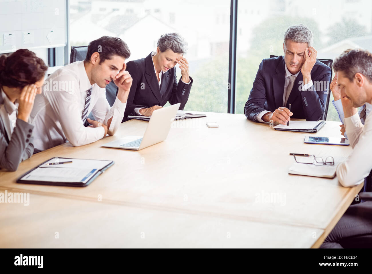 Business team hungover at meeting Stock Photo - Alamy