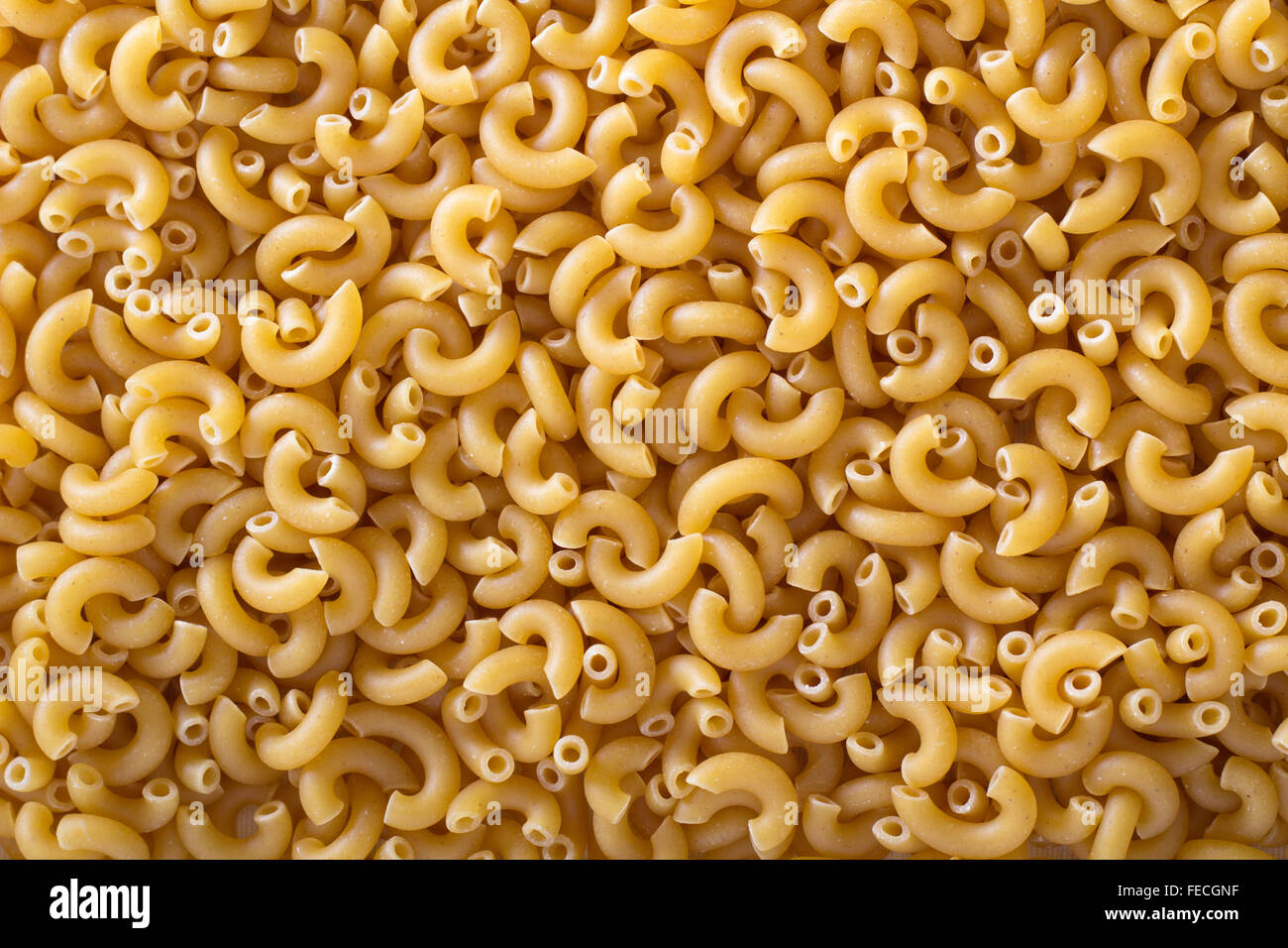 Pasta Elbow Macaroni background small pasta shapes Stock Photo - Alamy