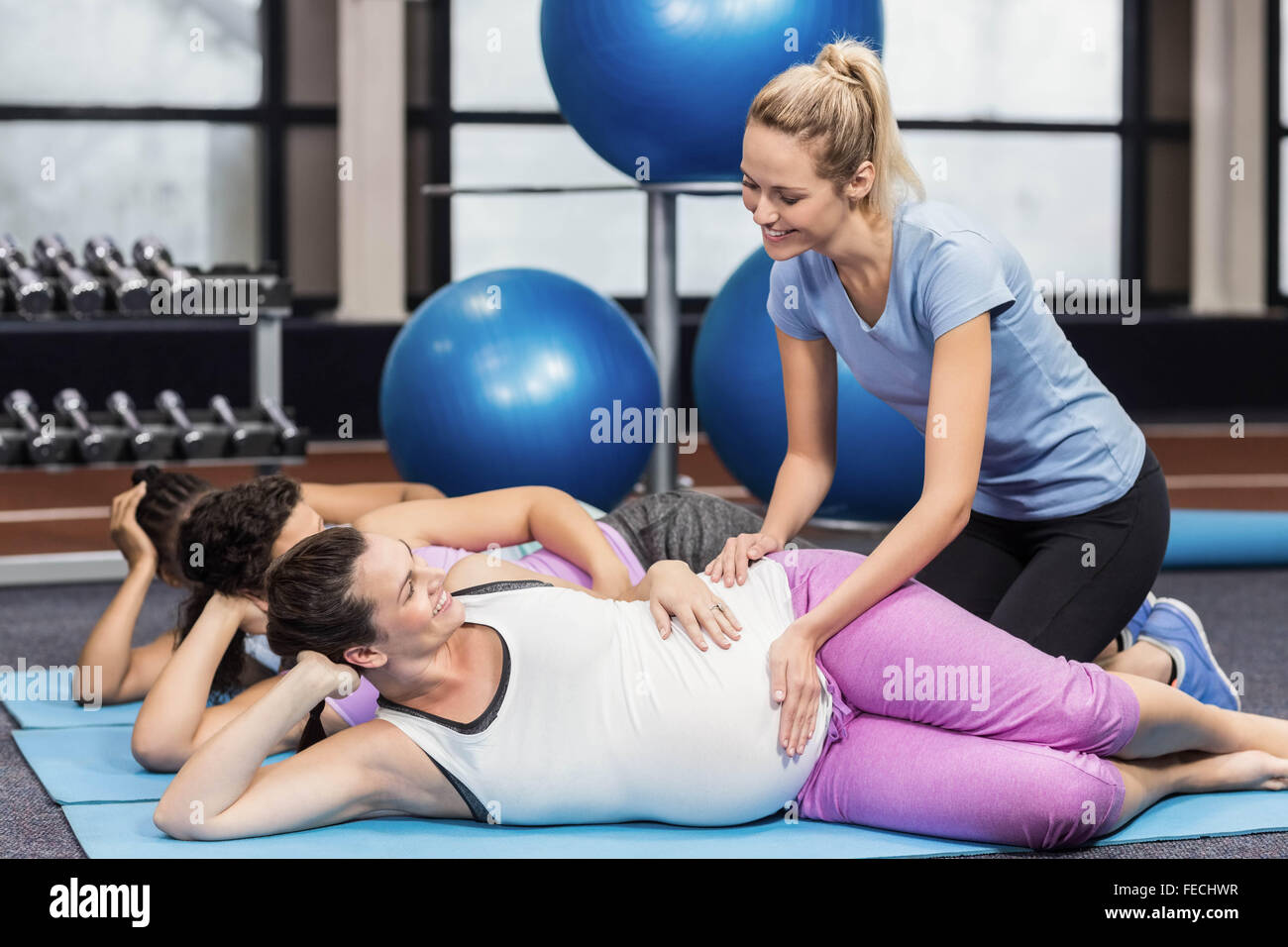 Beautiful pregnant woman fitness trainer hi-res stock photography and ...