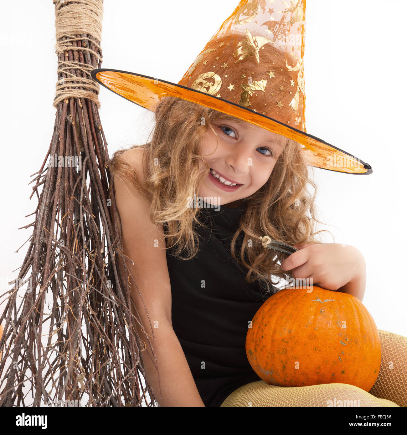 Portrait of a charming little witch Stock Photo - Alamy