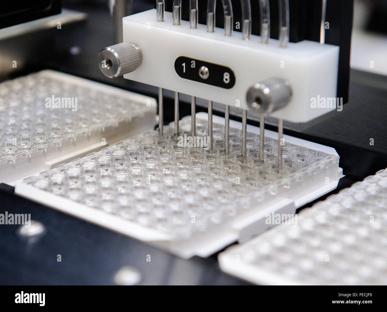 Dassow, Germany. 05th Feb, 2016. A machine produces microtitre plates ...