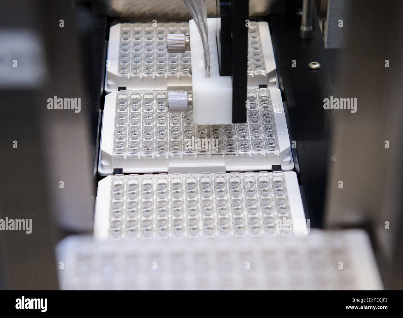 Dassow, Germany. 05th Feb, 2016. A machine produces microtitre plates ...
