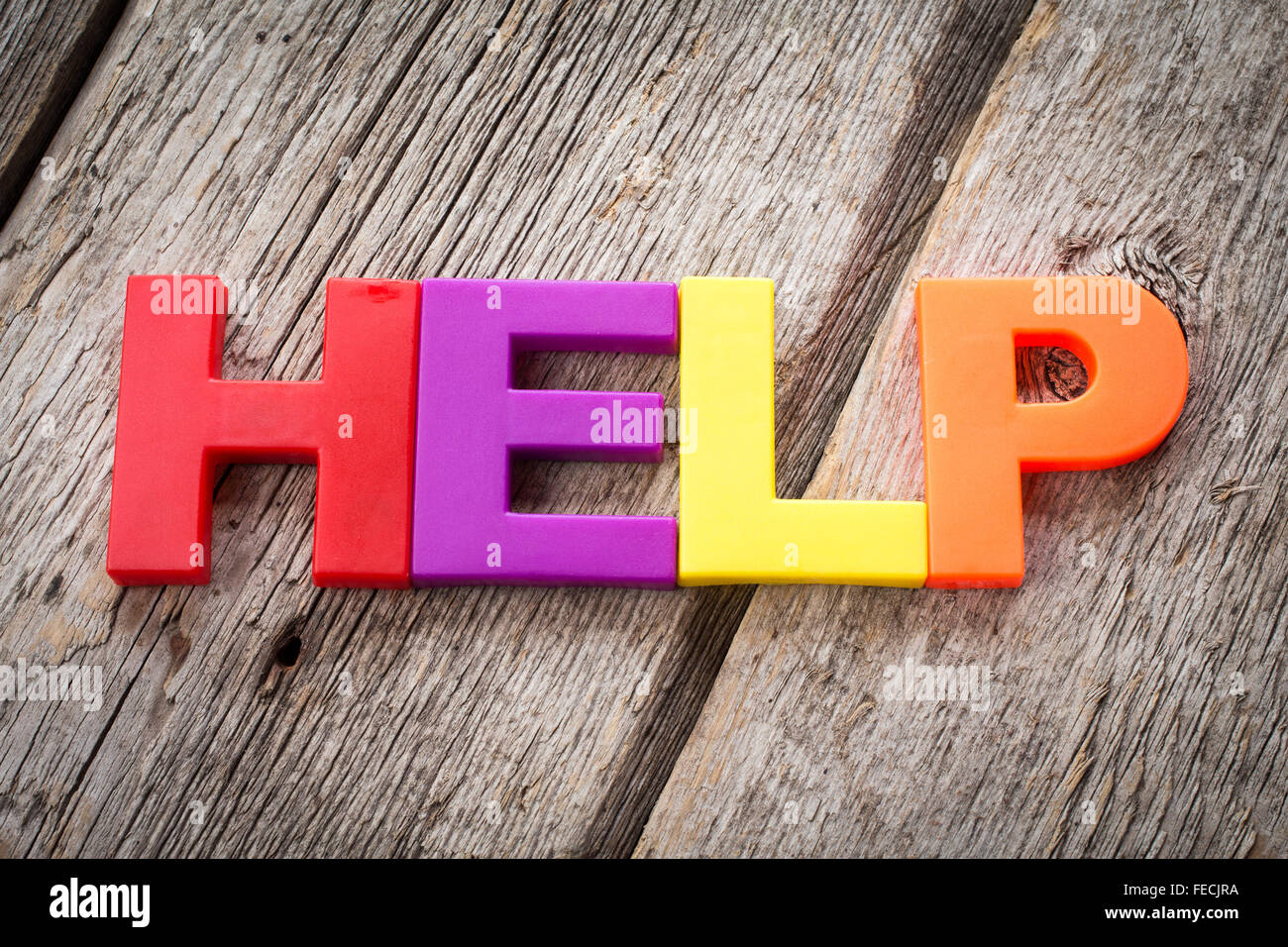 Letter magnets spelling word help hi-res stock photography and images ...