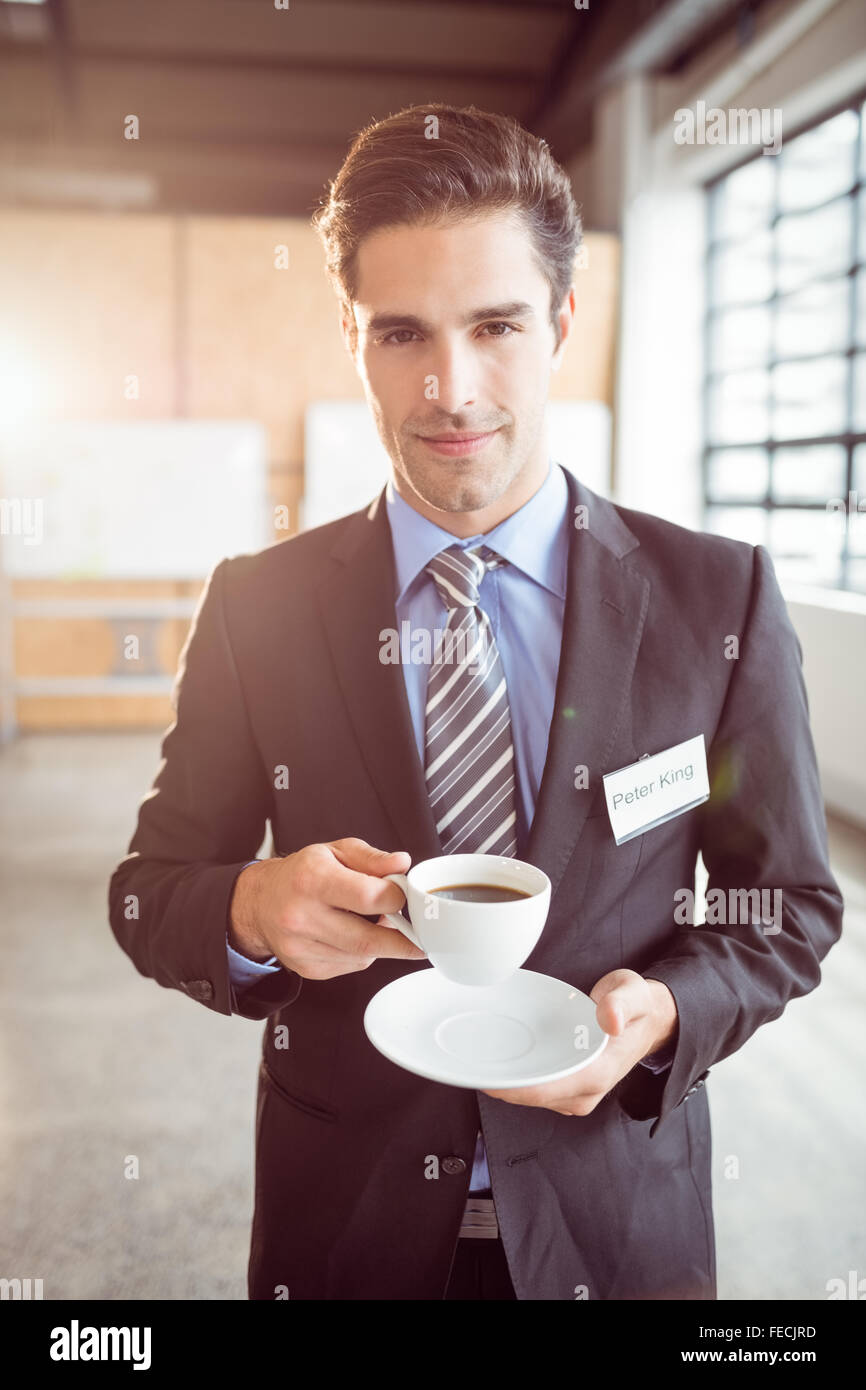 Businessman smiling at conference Stock Photo - Alamy