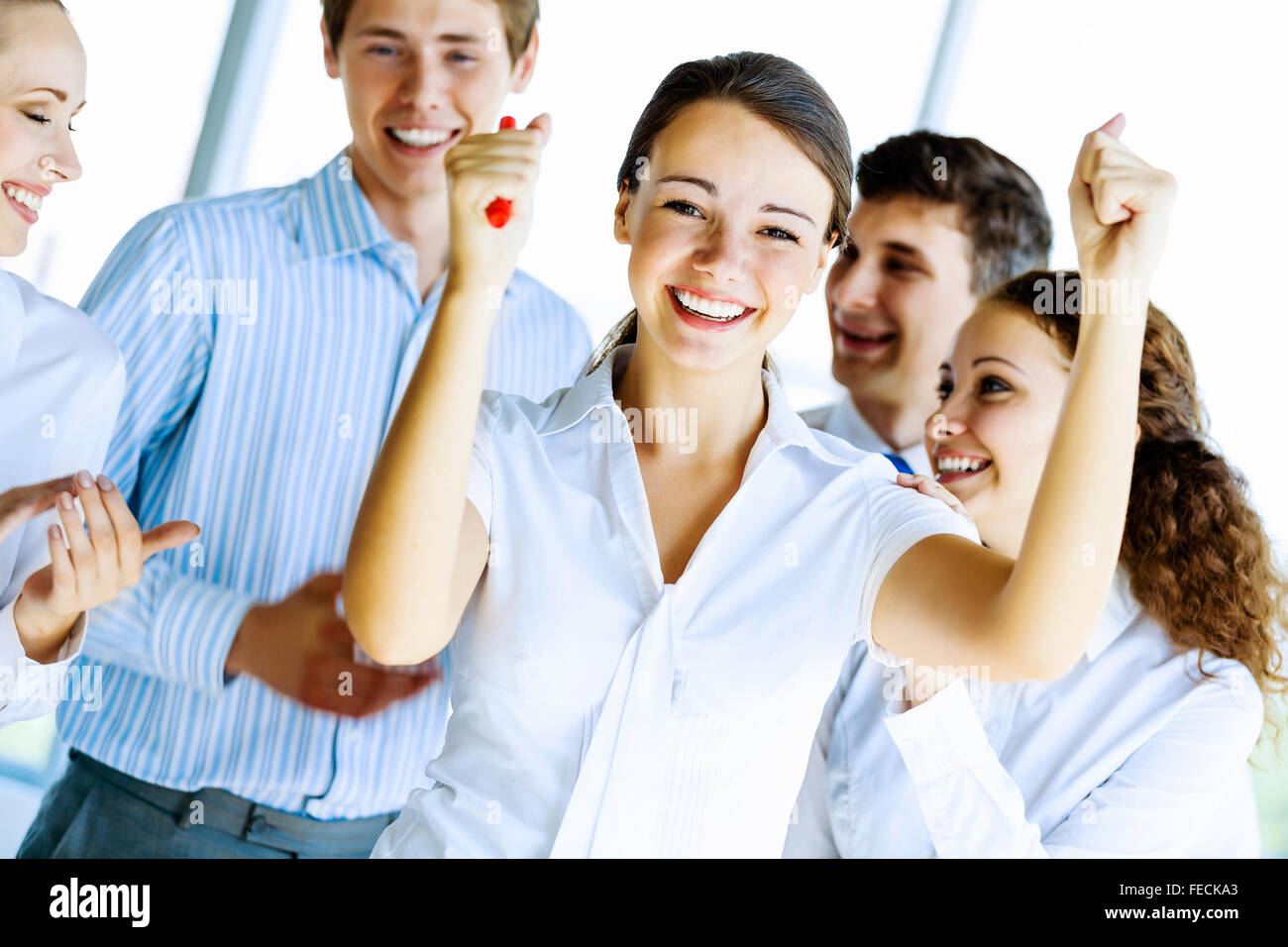 Image of young businesspeople congratulating colleague. Success concept ...