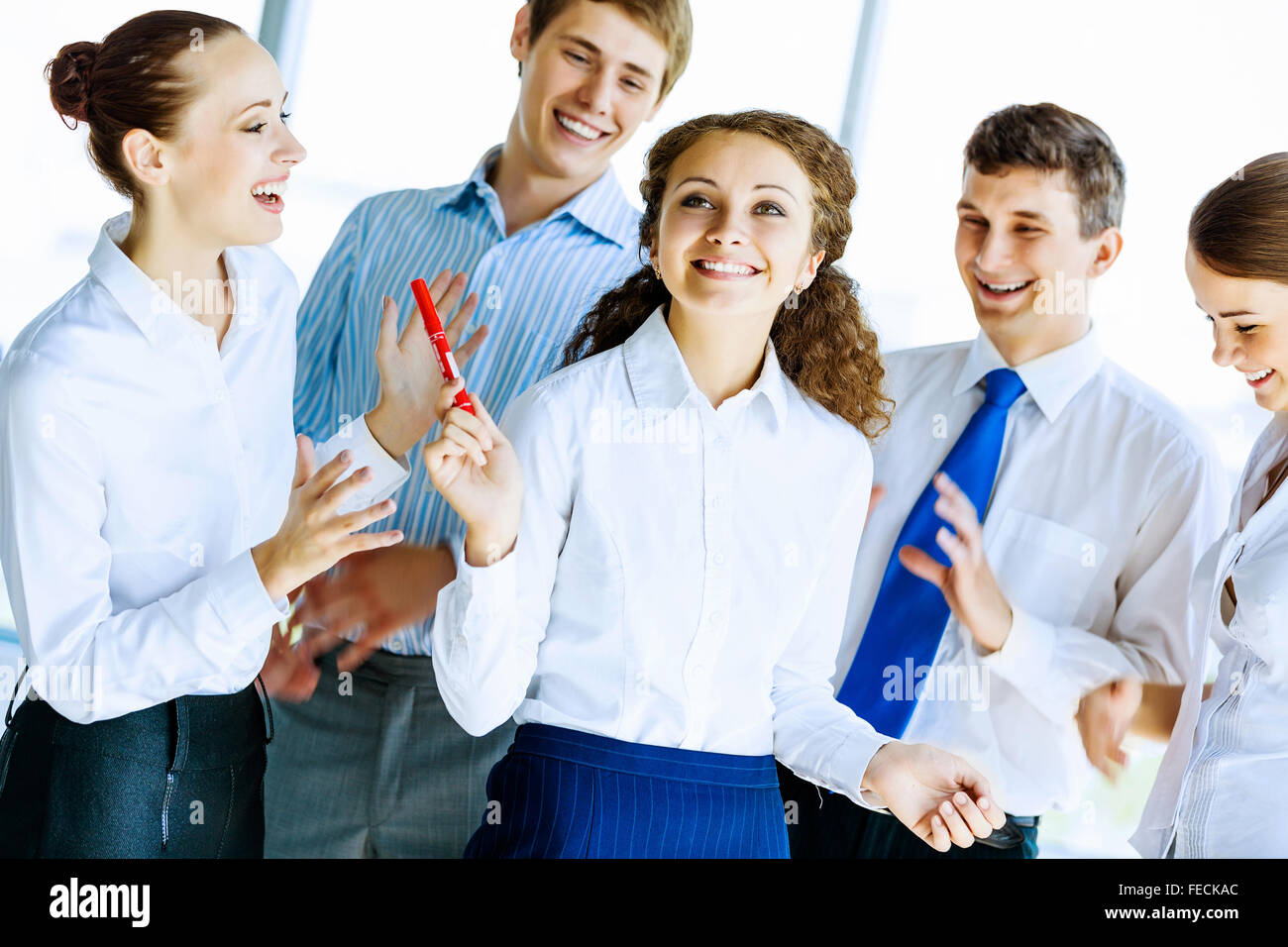Image of young businesspeople congratulating colleague. Success concept ...