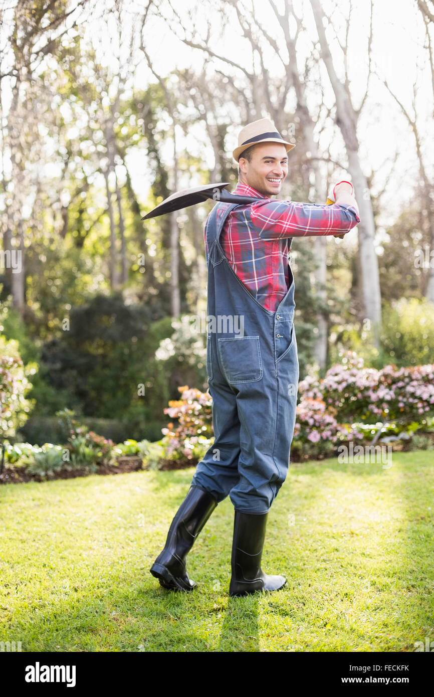 Gardener man posing with his shovel Stock Photo - Alamy