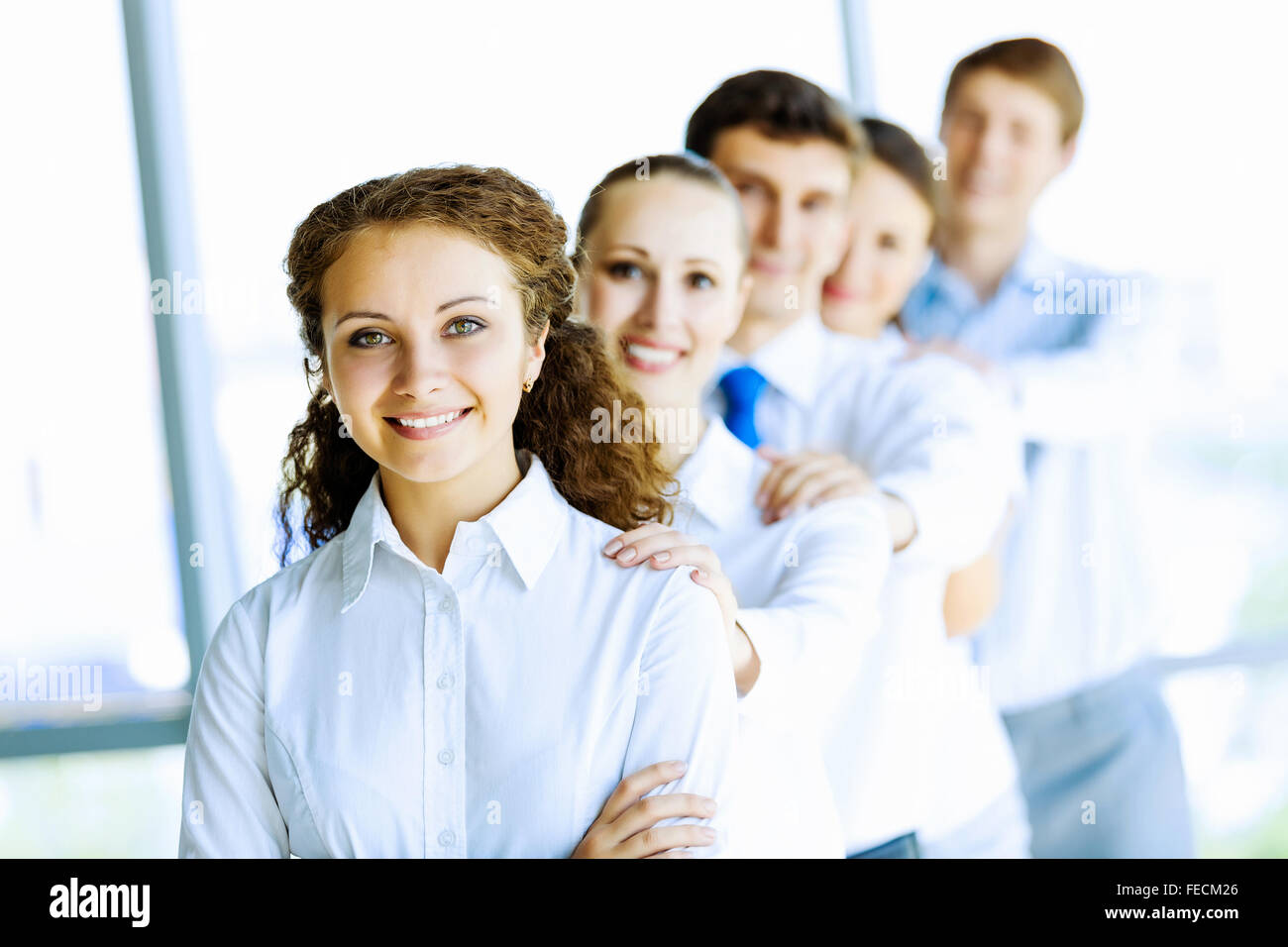 Image of young business people standing in line. Interaction concept ...