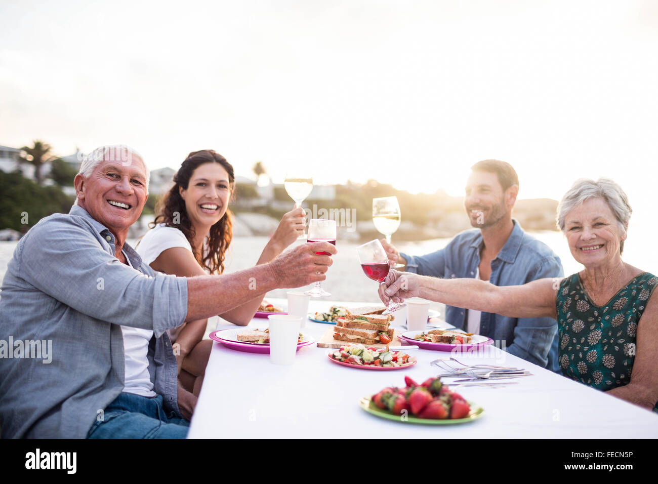 Cute family having dinner Stock Photo - Alamy