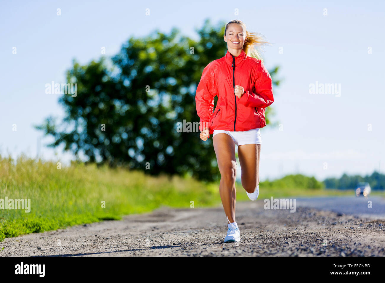 Image of young attractive woman running outdoor Stock Photo - Alamy