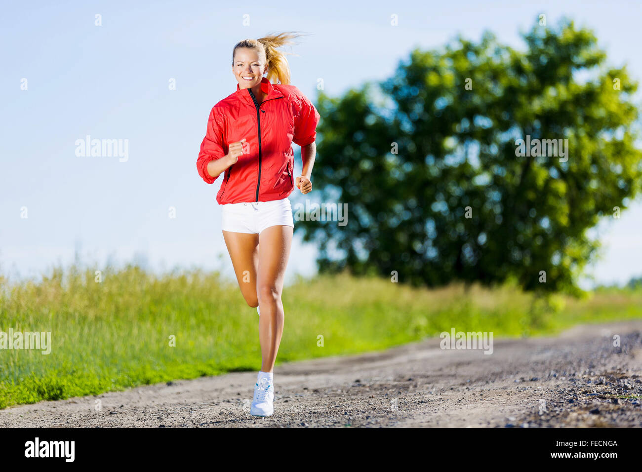 Image of young attractive woman running outdoor Stock Photo - Alamy