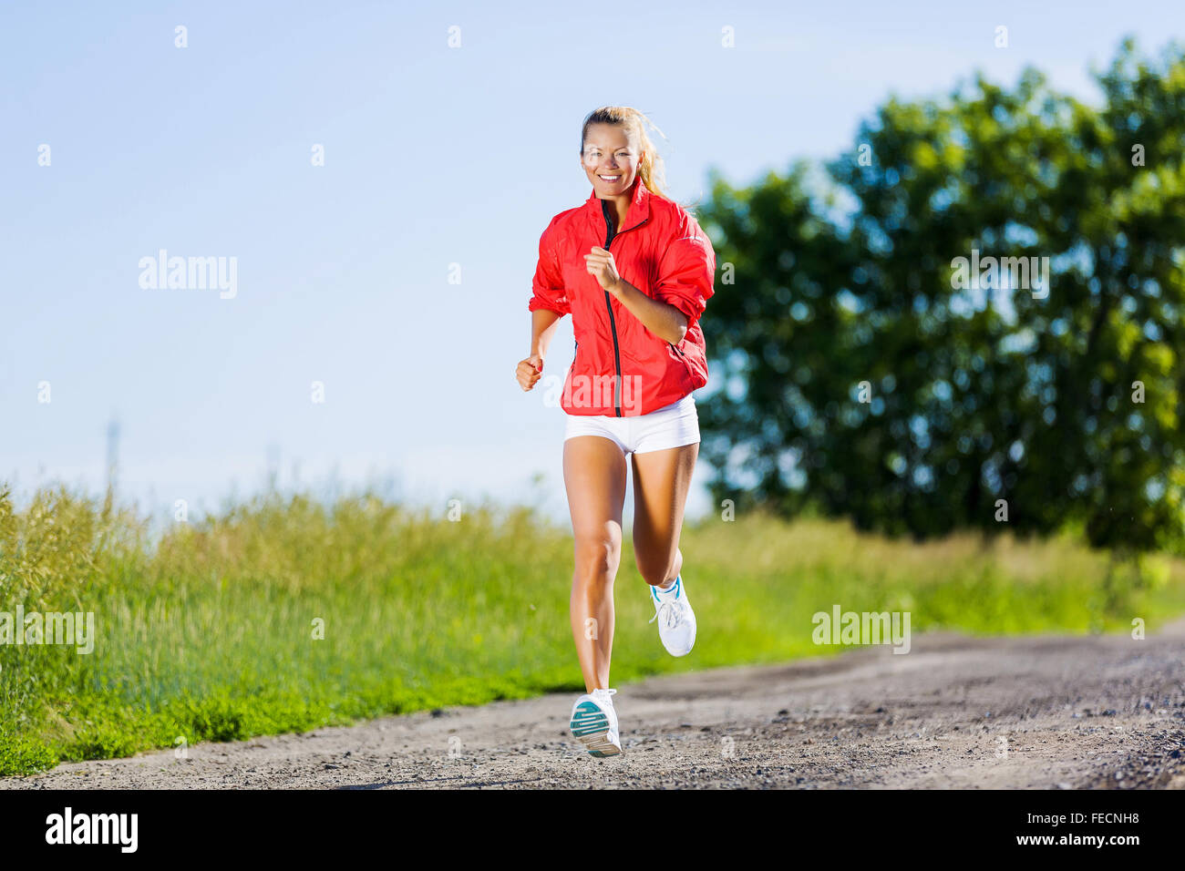 Image of young attractive woman running outdoor Stock Photo - Alamy