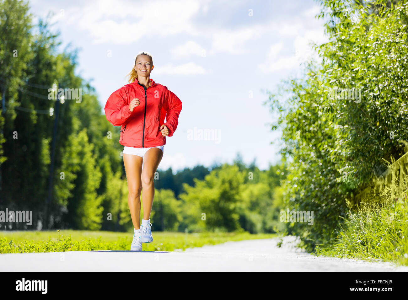 Image of young attractive woman running outdoor Stock Photo - Alamy