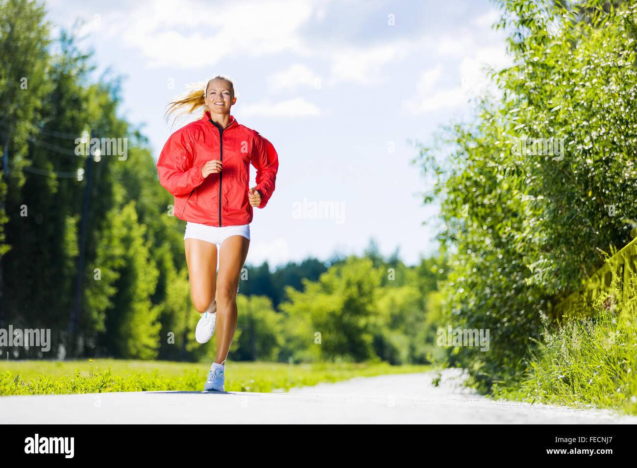 Image of young attractive woman running outdoor Stock Photo - Alamy