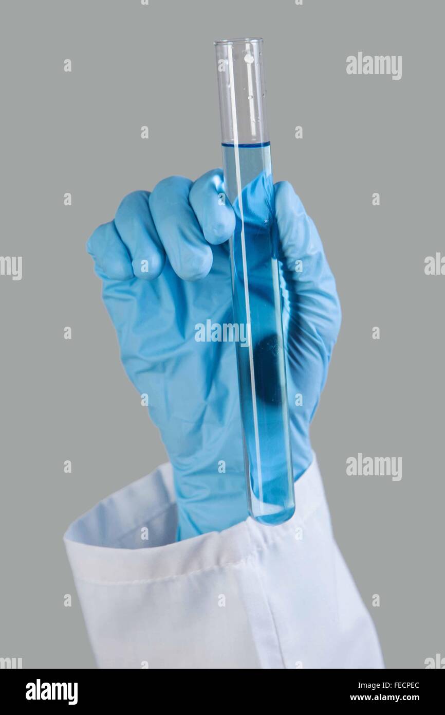 Close up image of scientist hands holding testing tube Stock Photo - Alamy