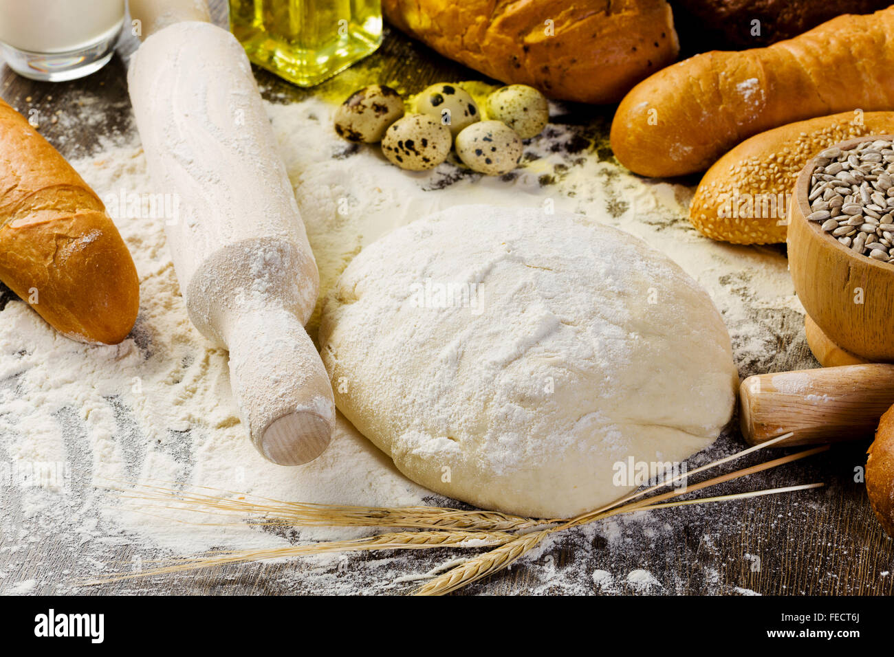 White bread drought and flour on kitchen table Stock Photo - Alamy