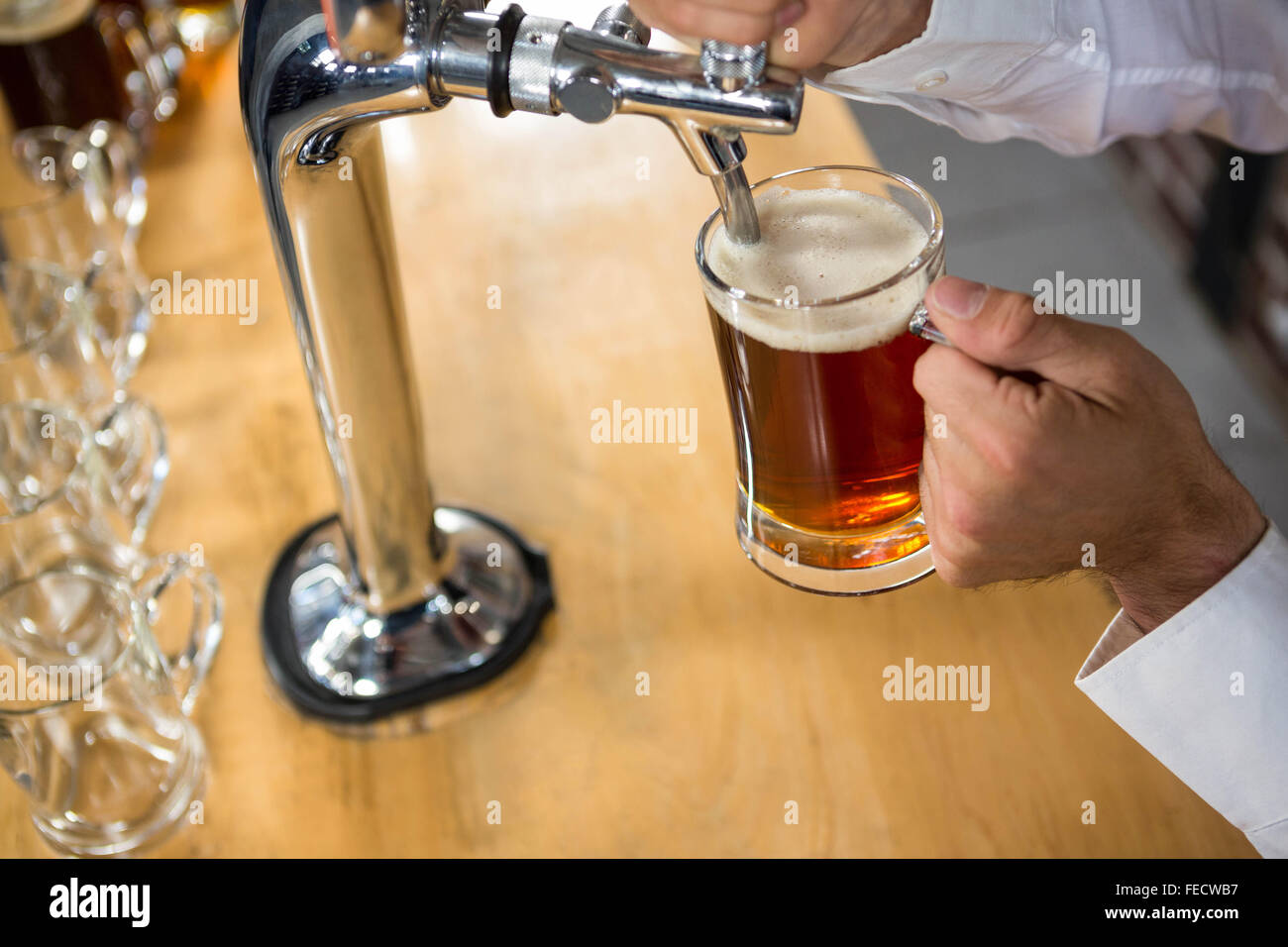 Pulling the tap hi-res stock photography and images - Alamy