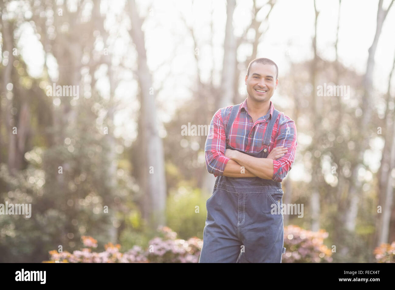 Front view of handsome man gardening Stock Photo - Alamy