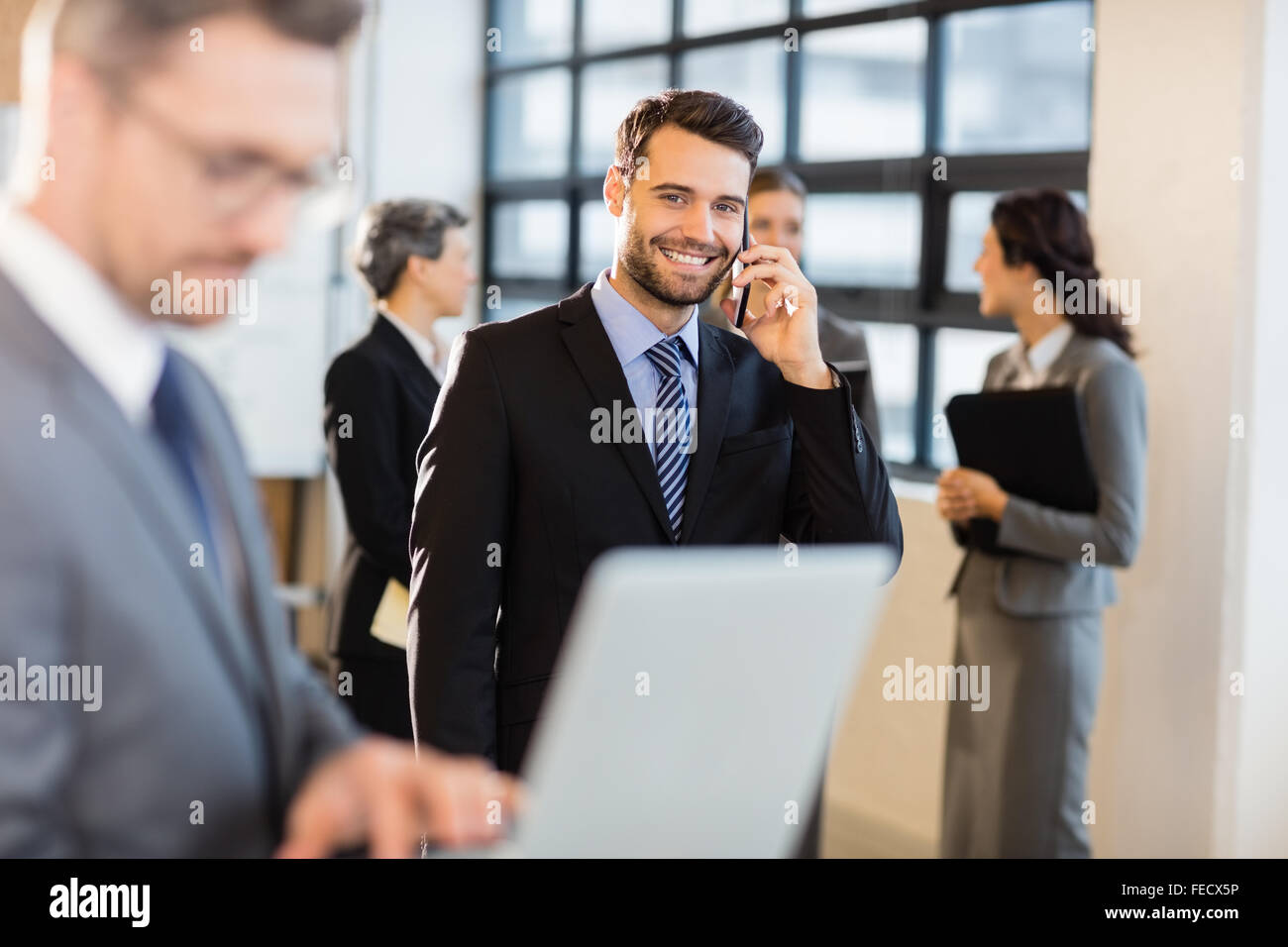 Smart businessman calling partners using hi-res stock photography and ...