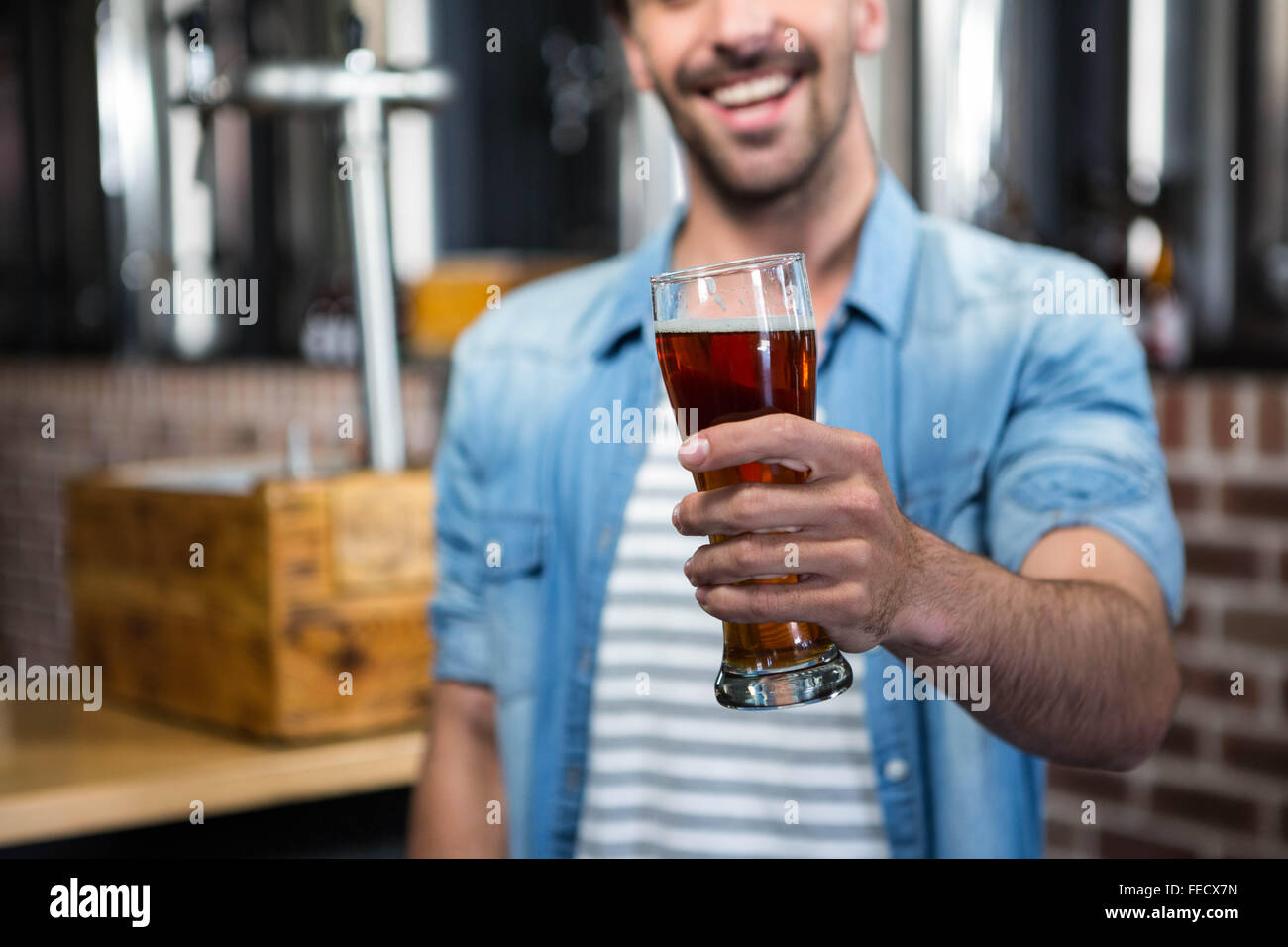 Man holding pint hi-res stock photography and images - Alamy