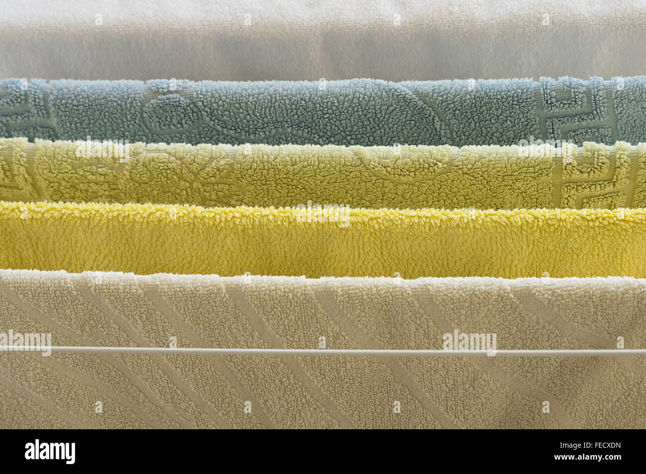Rainbow of colored towels - yellow, cream, green, blue and white Stock ...