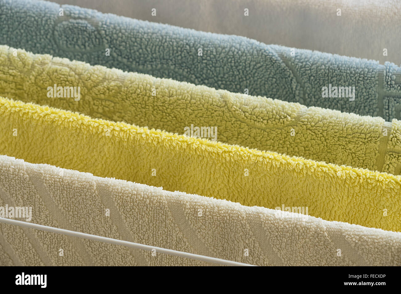 Rainbow of colored towels - yellow, cream, green, blue and white Stock ...
