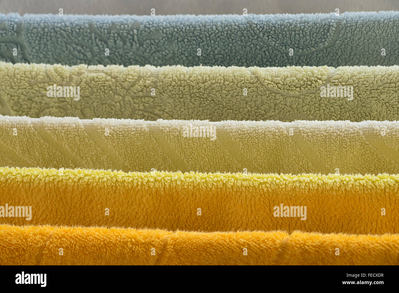 Rainbow of colored towels - orange, yellow, cream, green, blue and ...