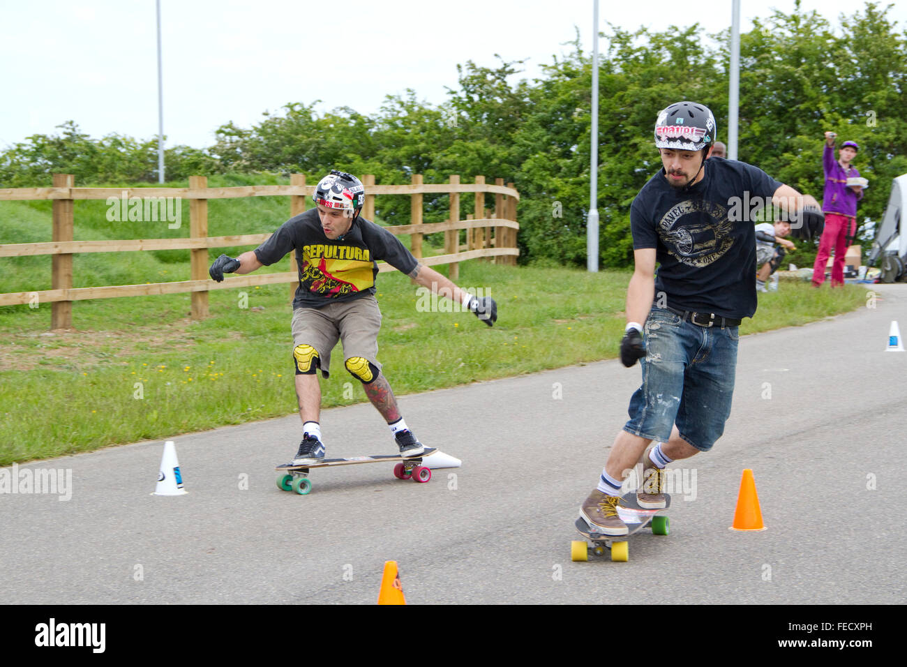 Two skateboarders compete in a skateboard slalom Stock Photo - Alamy