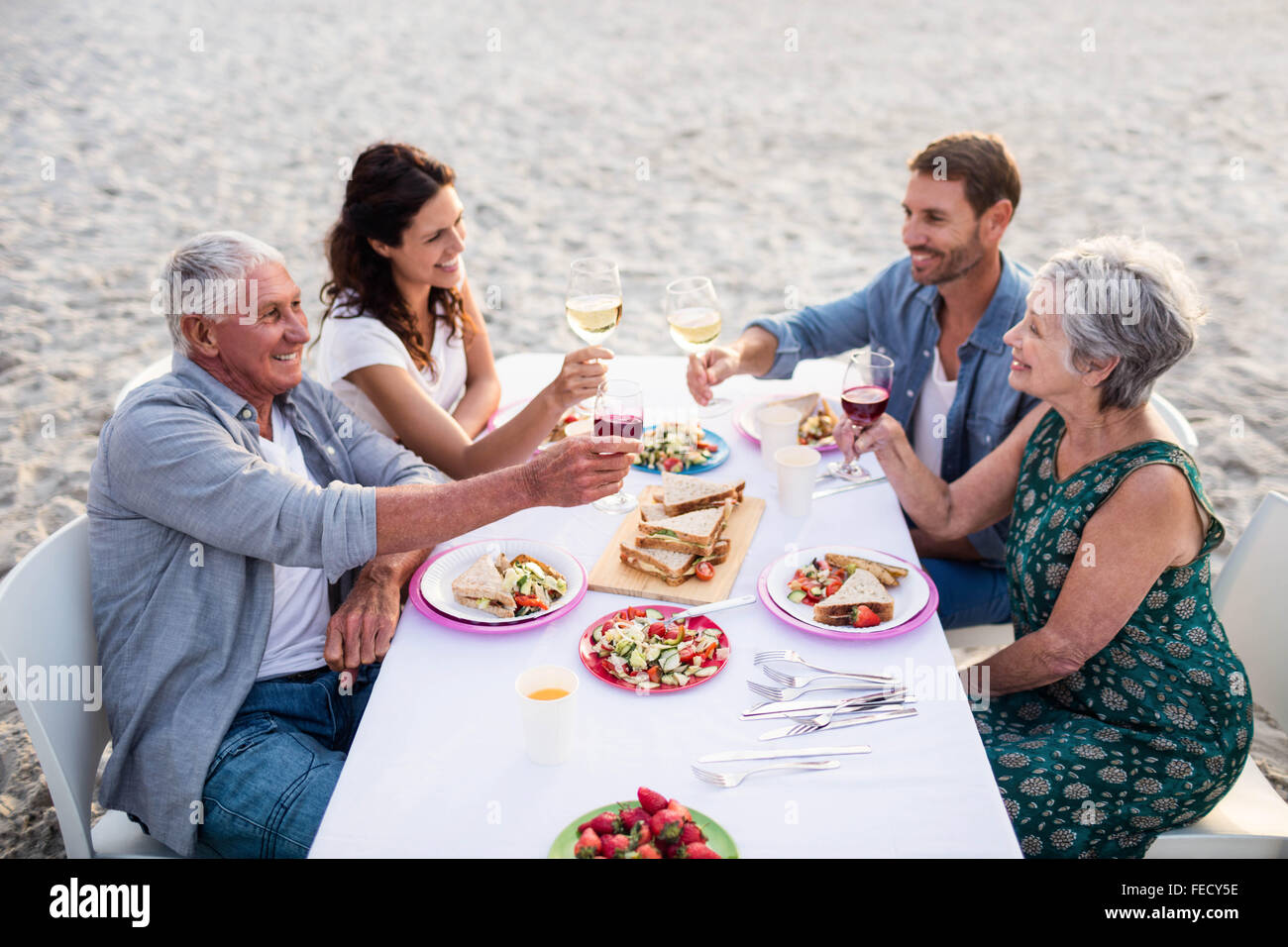 Cute family having dinner Stock Photo - Alamy