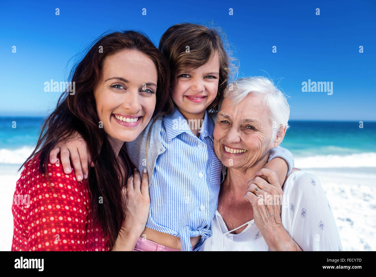 Multi generation family hugging and smiling Stock Photo - Alamy